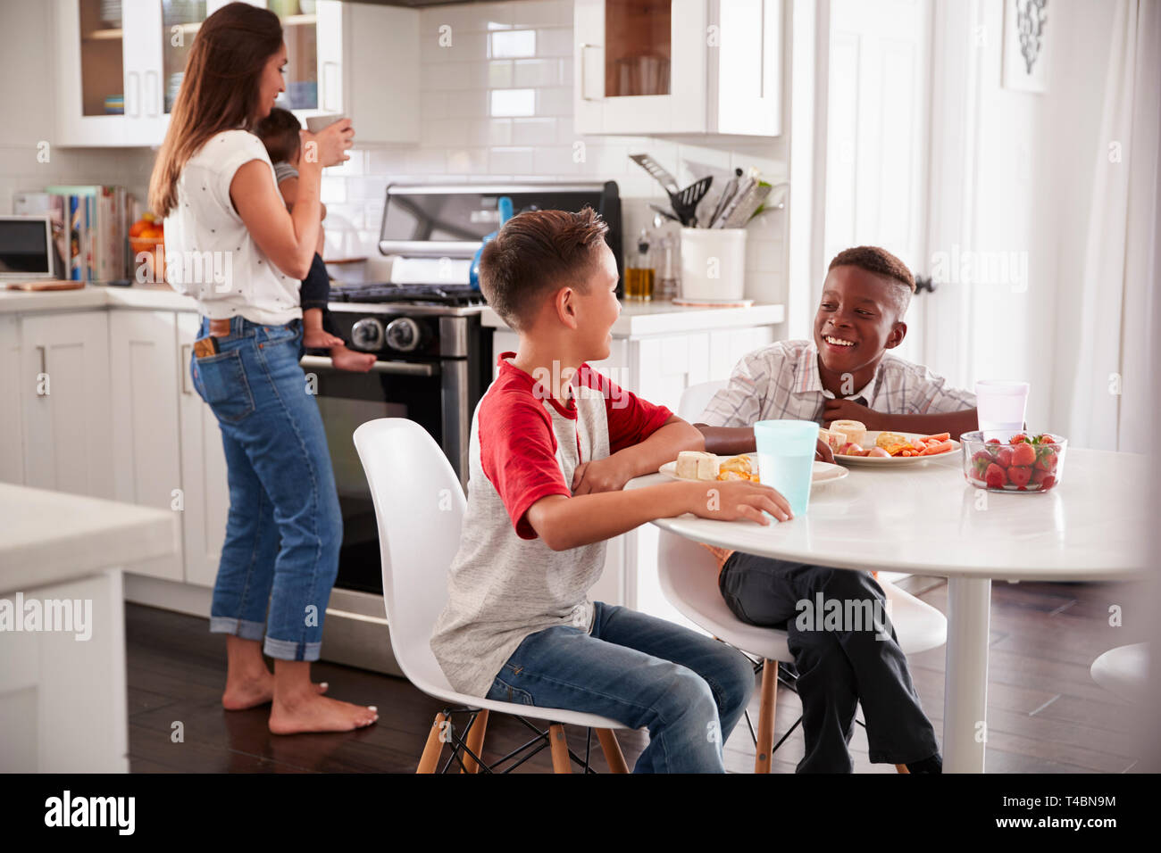 Teen boys talk kitchen hi-res stock photography and images - Alamy
