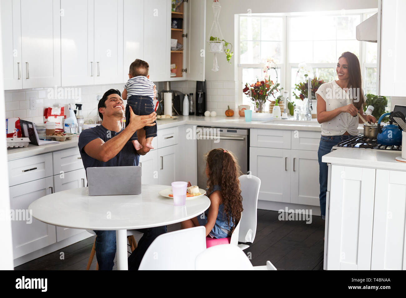 Hispanic mother cooking in kitchen hi-res stock photography and images ...