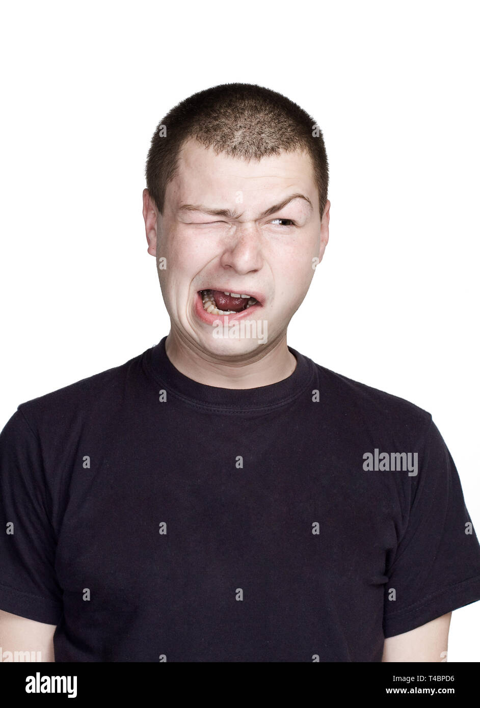Portrait of young man. Facial expression. Grimace face Stock Photo - Alamy