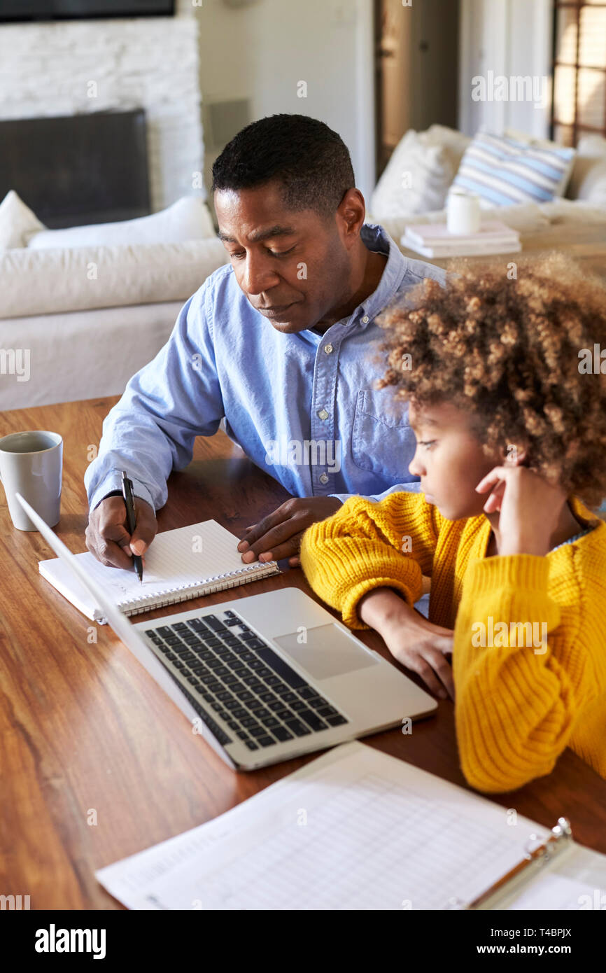 African girl sitting writing hi-res stock photography and images - Alamy