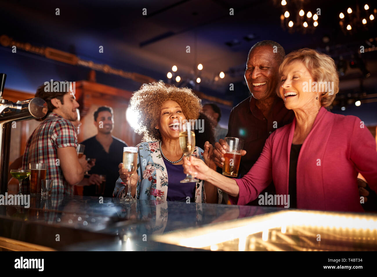 Group of seniors in bar men women hi-res stock photography and images ...