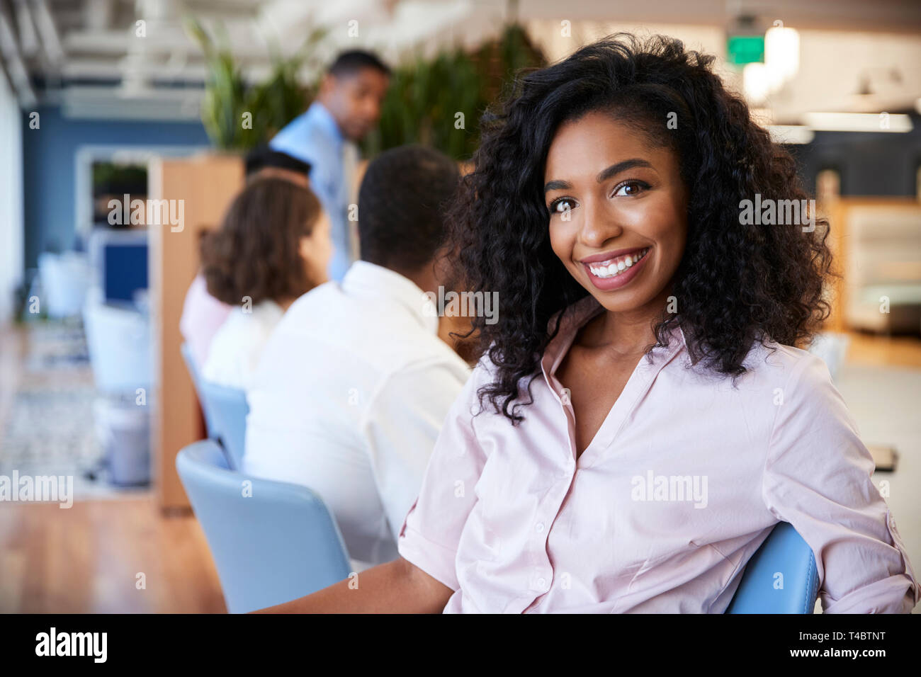 Businesswoman sitting meeting table portrait hi-res stock photography ...