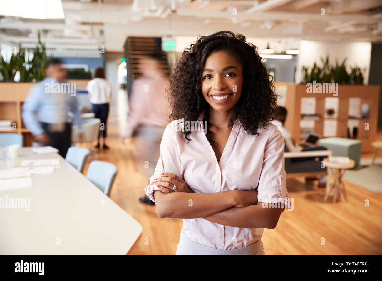 Successful group of business people at the office looking at the camera ...