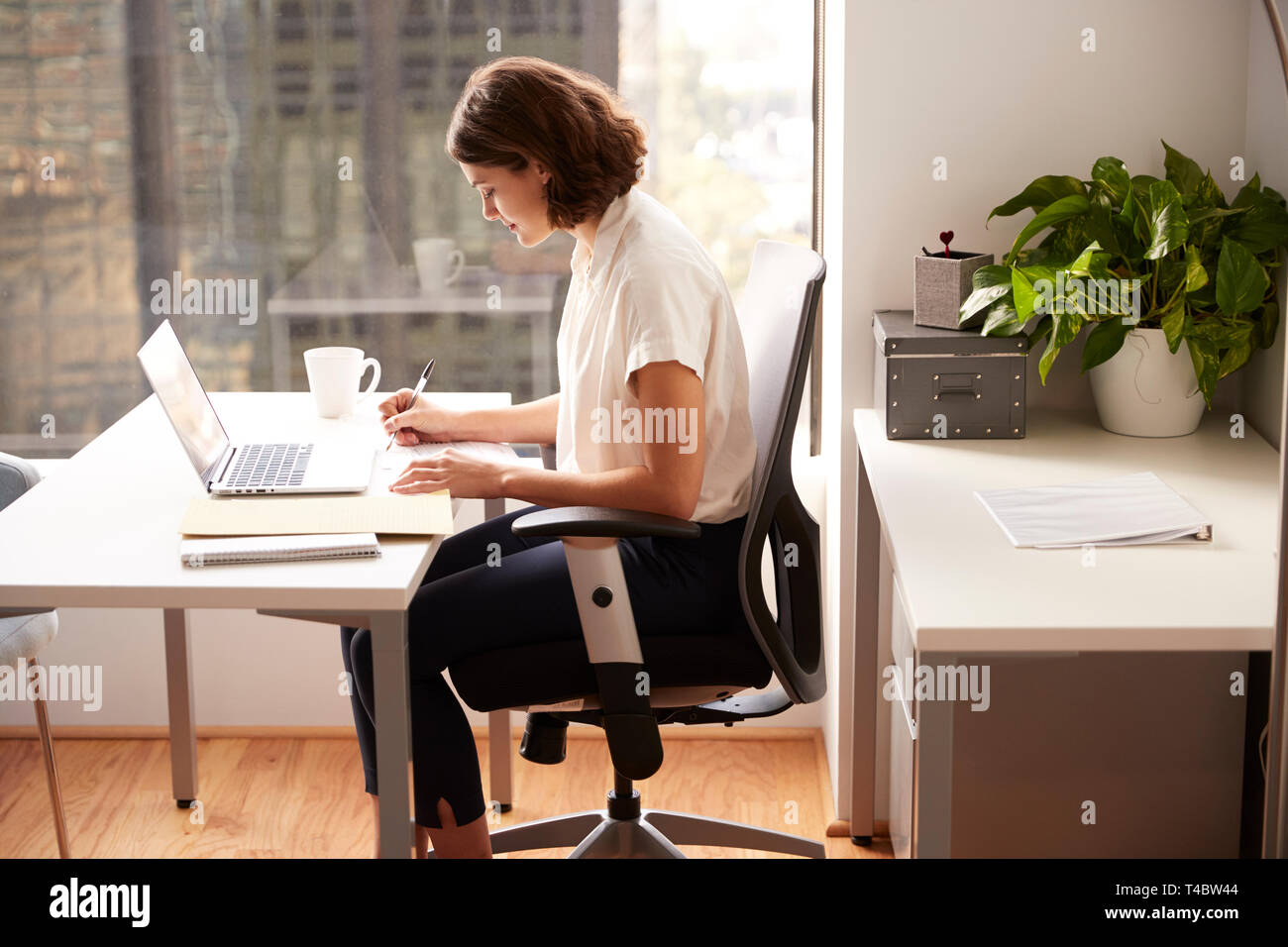 Executive sitting at desk hi-res stock photography and images - Alamy