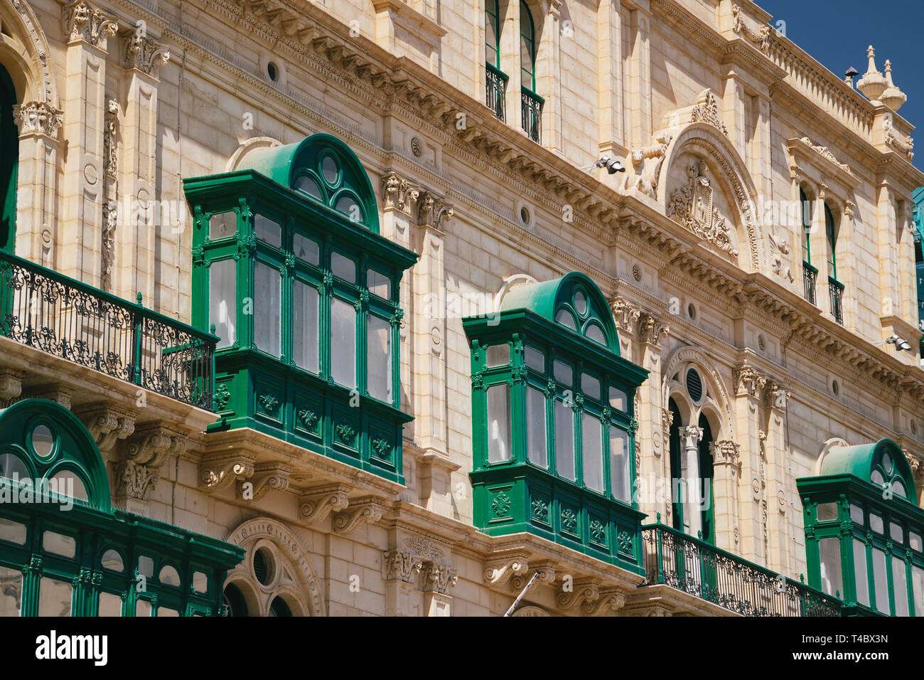 Typical traditional wooden green maltese balconies in the centre of ...