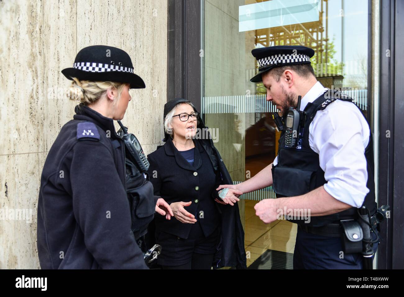 London, UK. 15th Apr, 2019. A protester with broken glass super glued ...