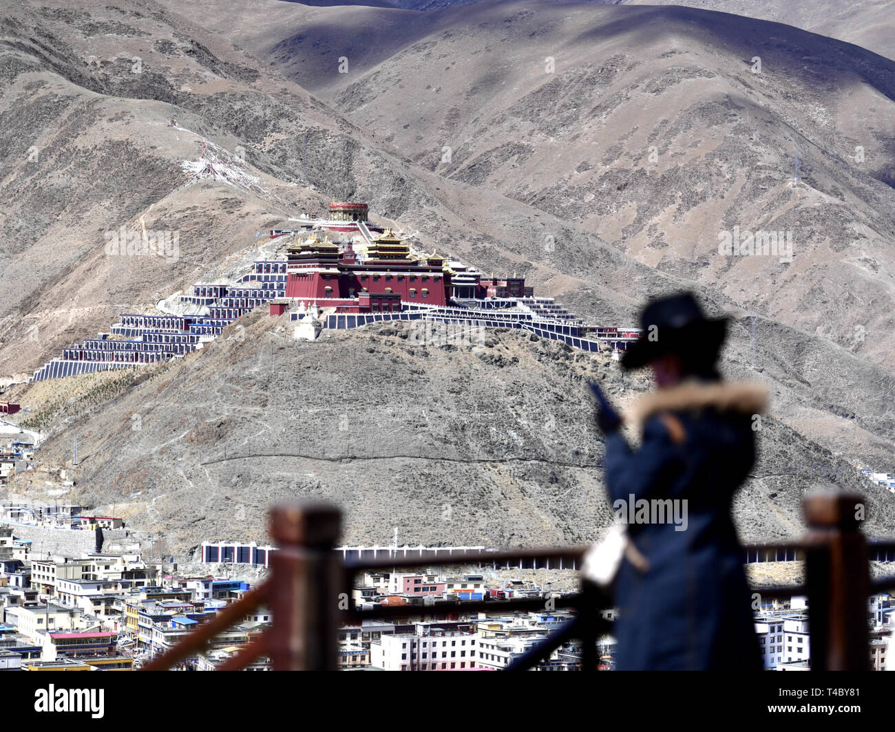 Yushu, China's Qinghai Province. 14th Apr, 2019. A tourist takes photos ...