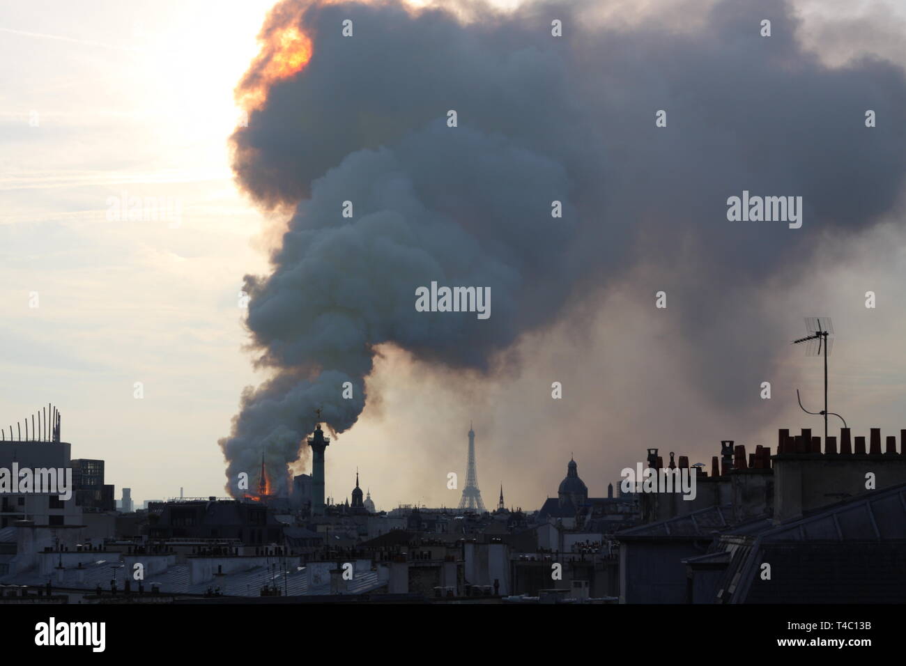 Paris, France. 15th Apr, 2019. A huge column of smoke stands above one ...
