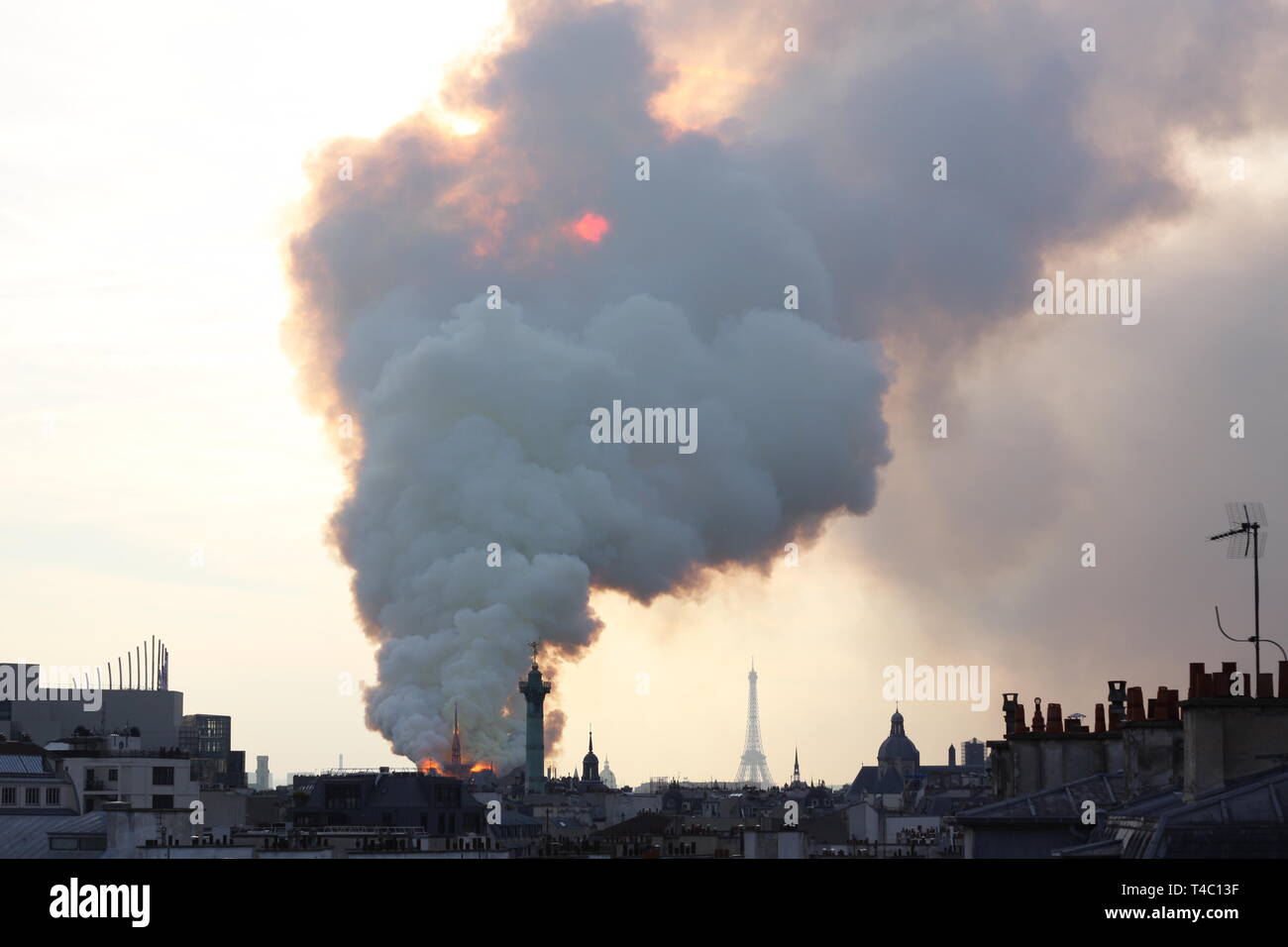 Paris, France. 15th Apr, 2019. A huge column of smoke stands above one ...