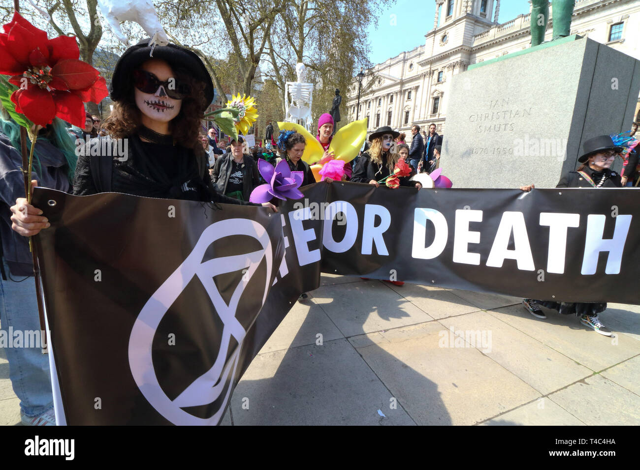 Protesters seen holding a large banner during the Extinction Rebellion ...
