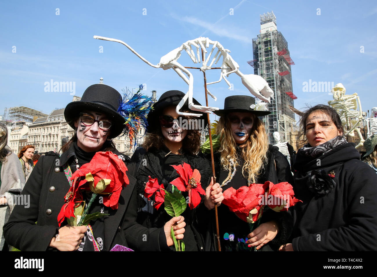 Environmental activists wearing black outfits are seen holding a ...