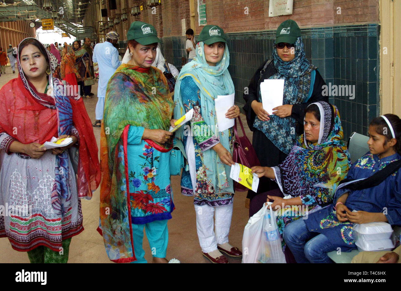 Employees of Lahore Waste Management Company (LWMC) are distributes ...