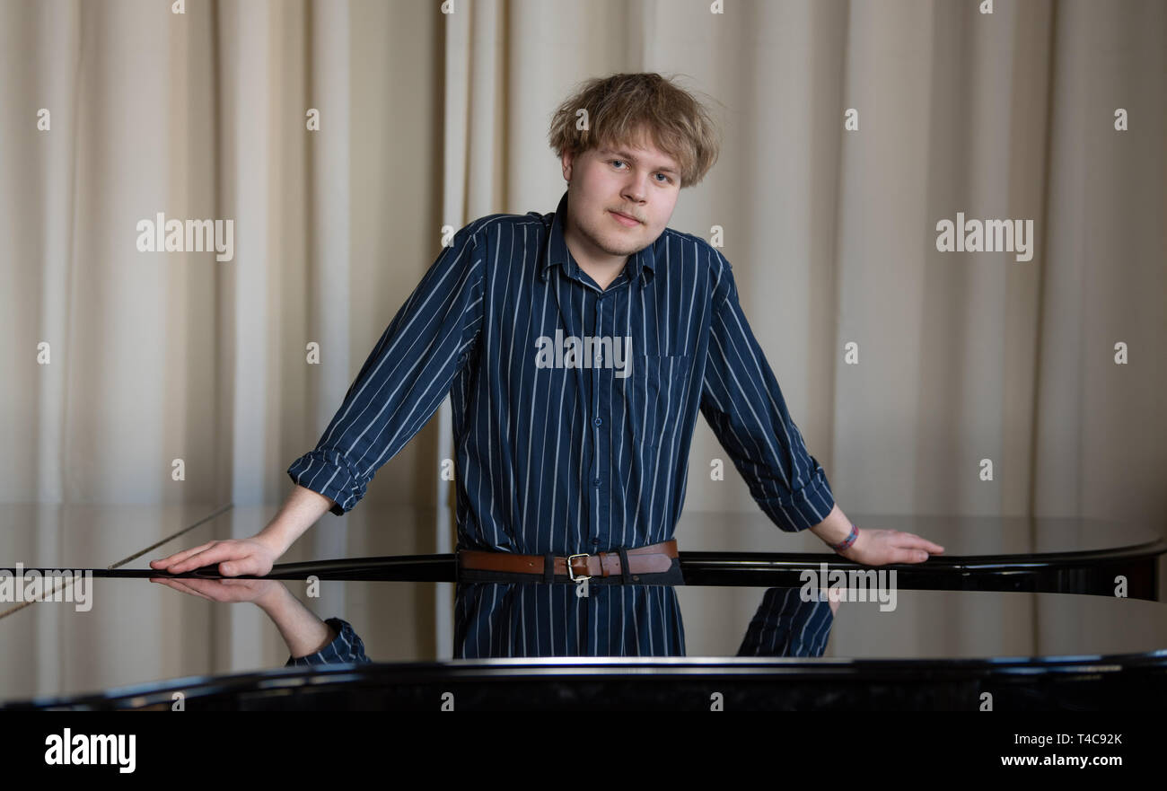 Dresden, Germany. 20th Mar, 2019. Pianist Vincent Meissner sits in the ...