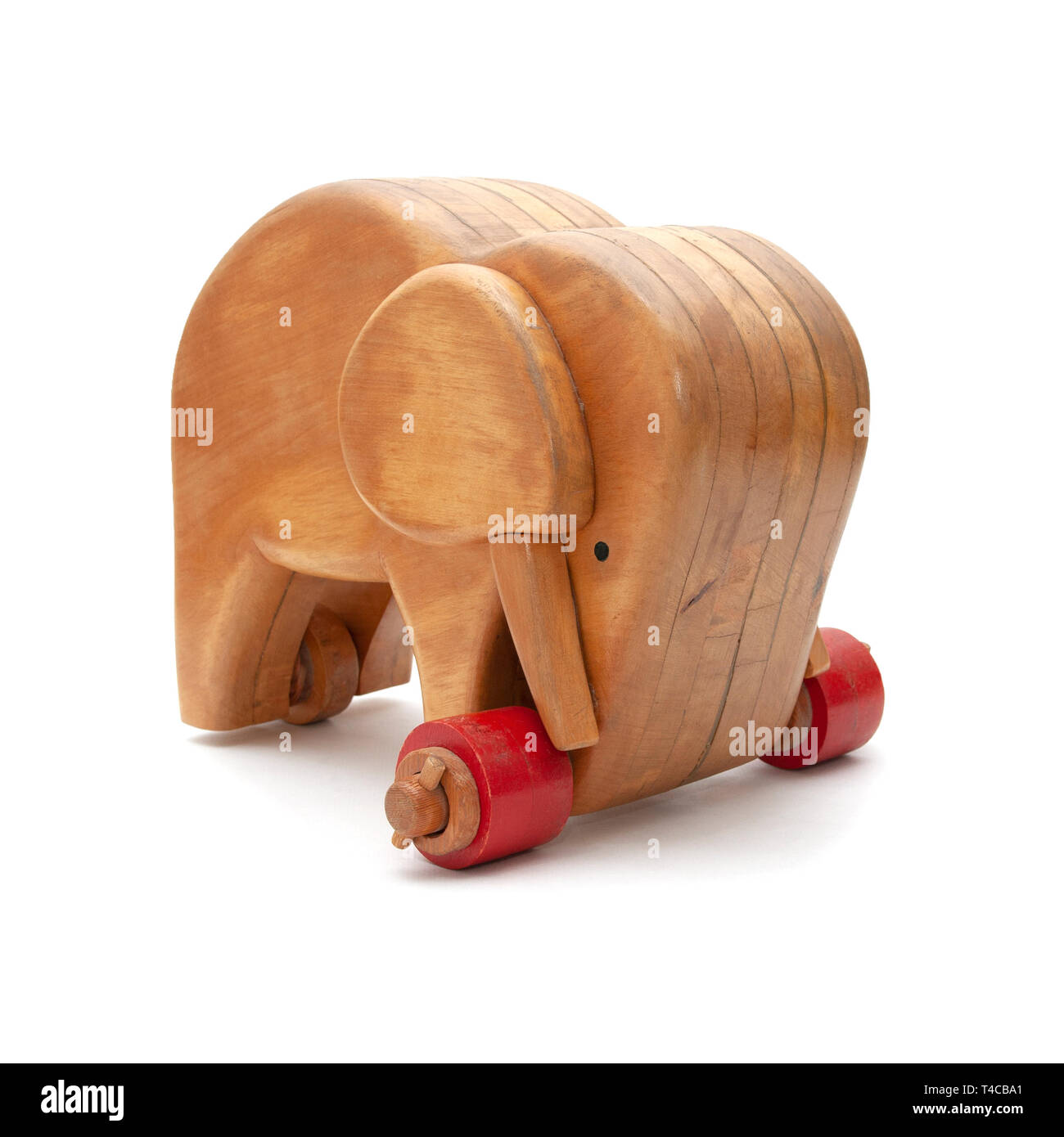 Wooden elephant with wheels on white background Stock Photo - Alamy