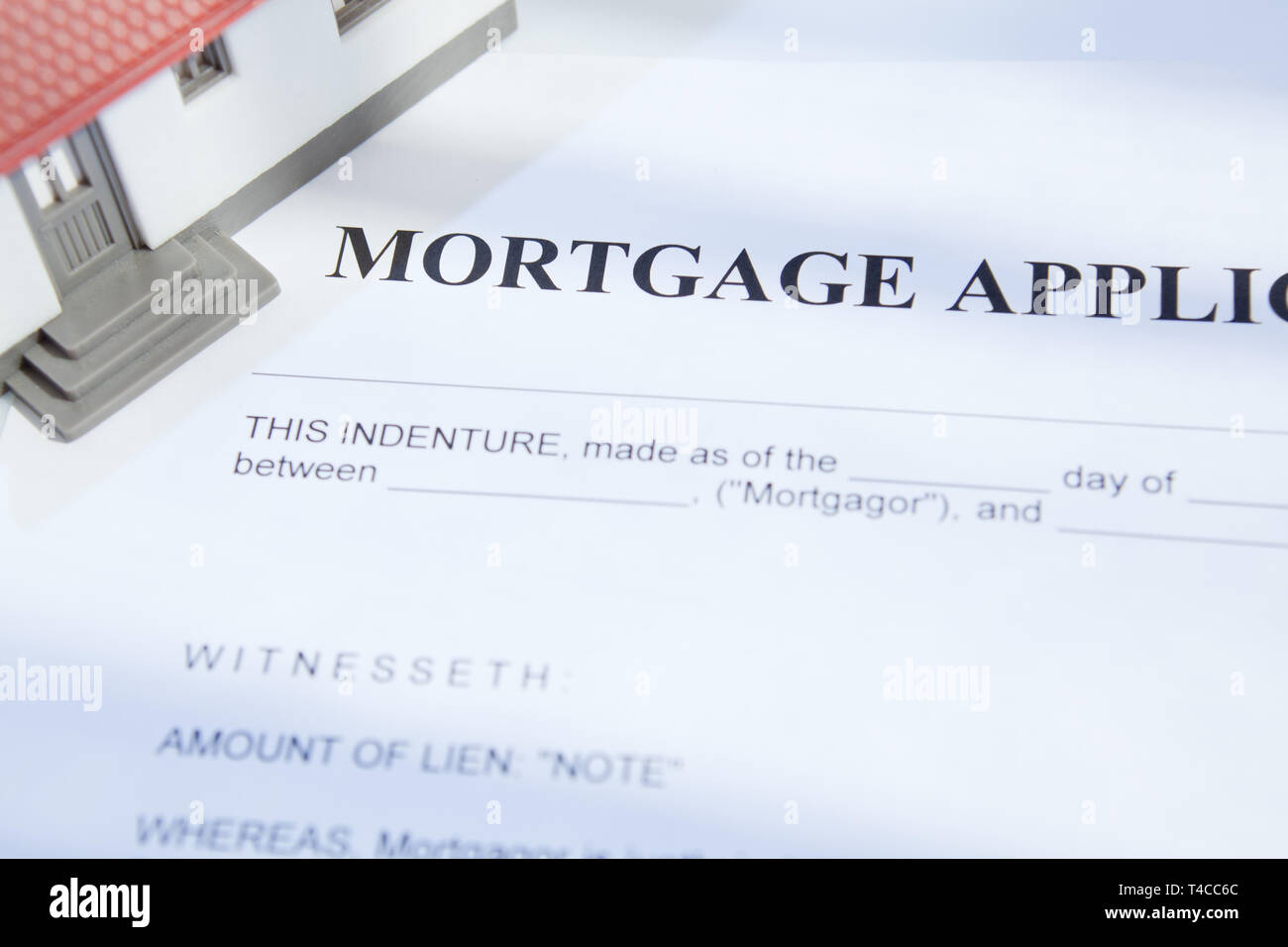 mortgage application form with a mini house for real estate Stock Photo ...