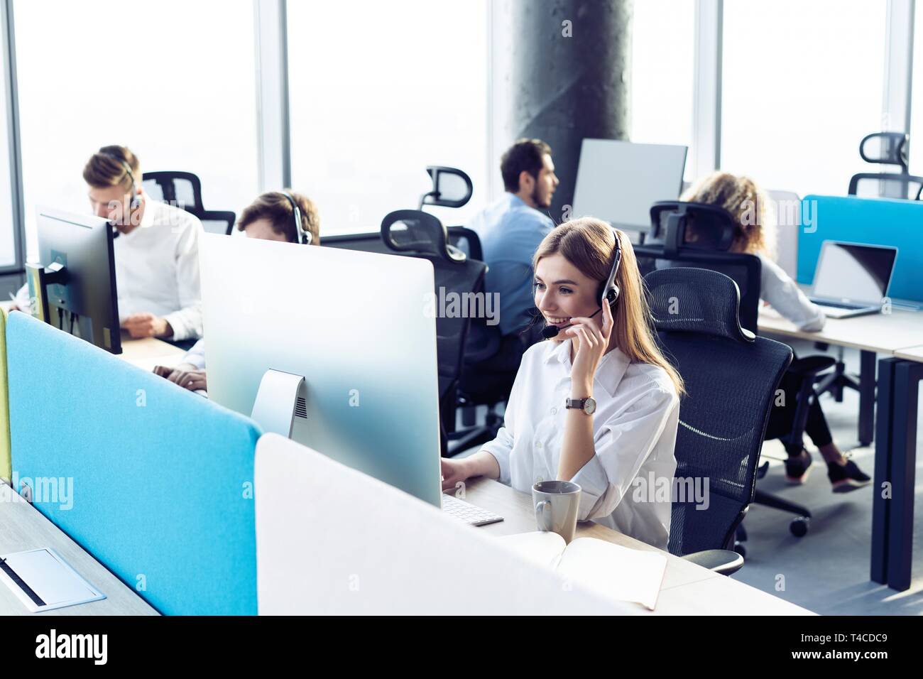 Young woman headset talking customers hi-res stock photography and ...