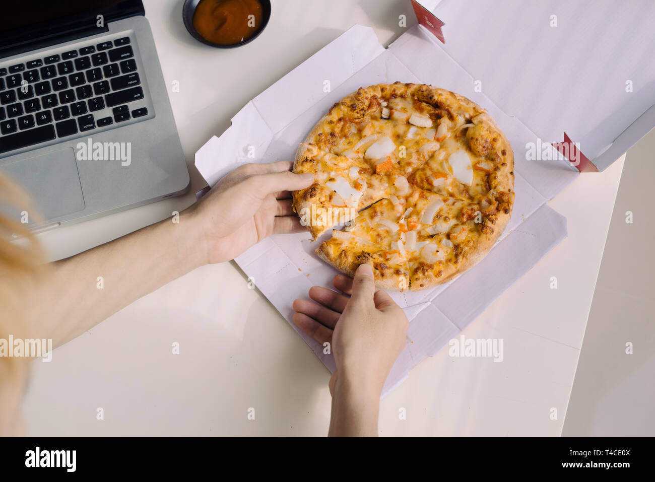 Happy man eating pizza night hi-res stock photography and images - Alamy