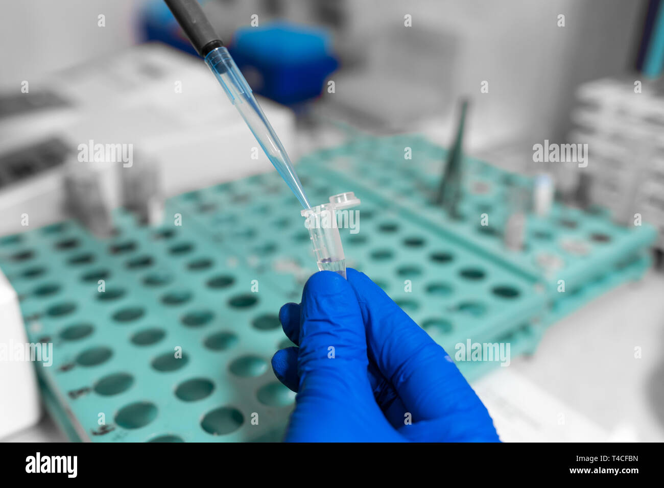 Closeup laboratory assistant analyzing a blood sample using ...