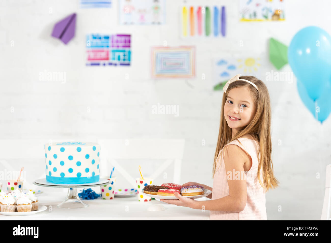Adorable kid holding plate hi-res stock photography and images - Alamy