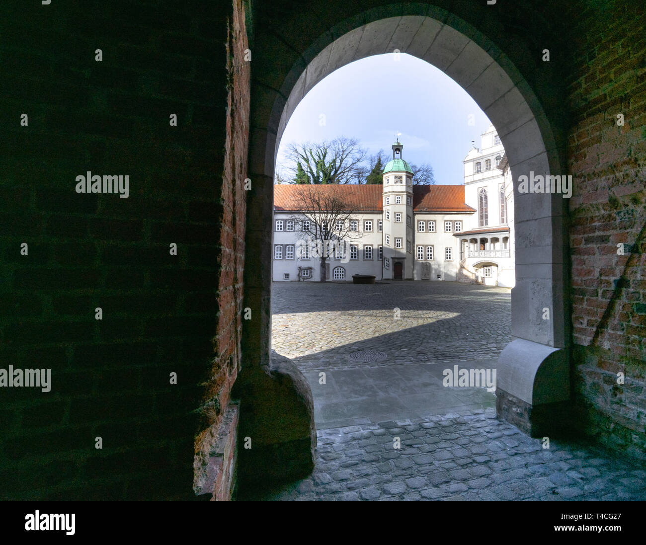 Castle viewed from afar through the passage behind the moat of the ...