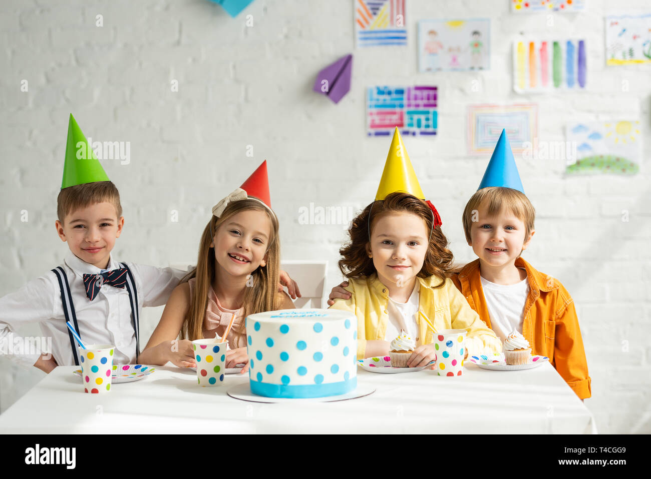 Kids with party hats hi-res stock photography and images - Alamy