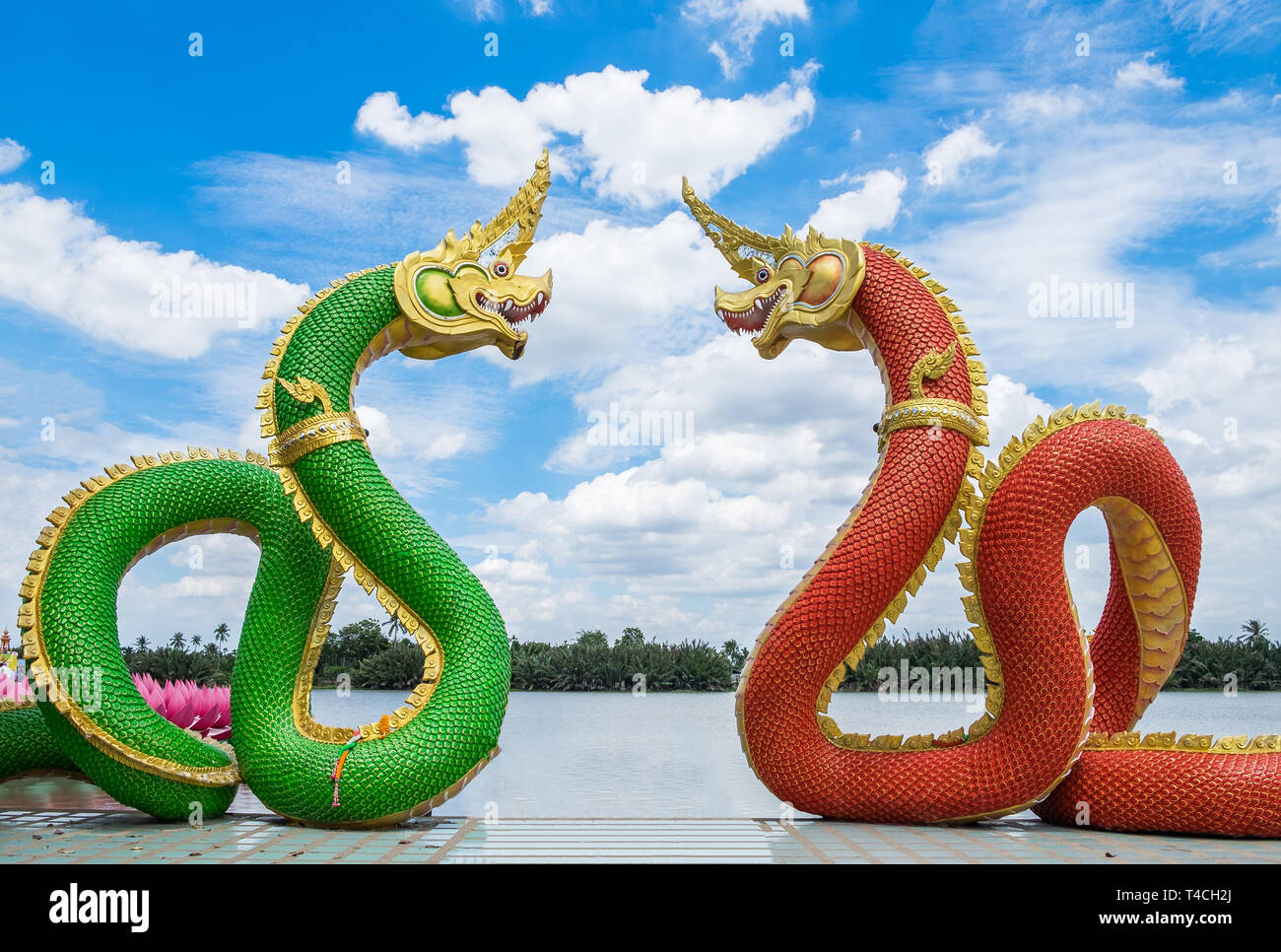 Statue naga mythology green red facing curve and blue sky in watsaman ...