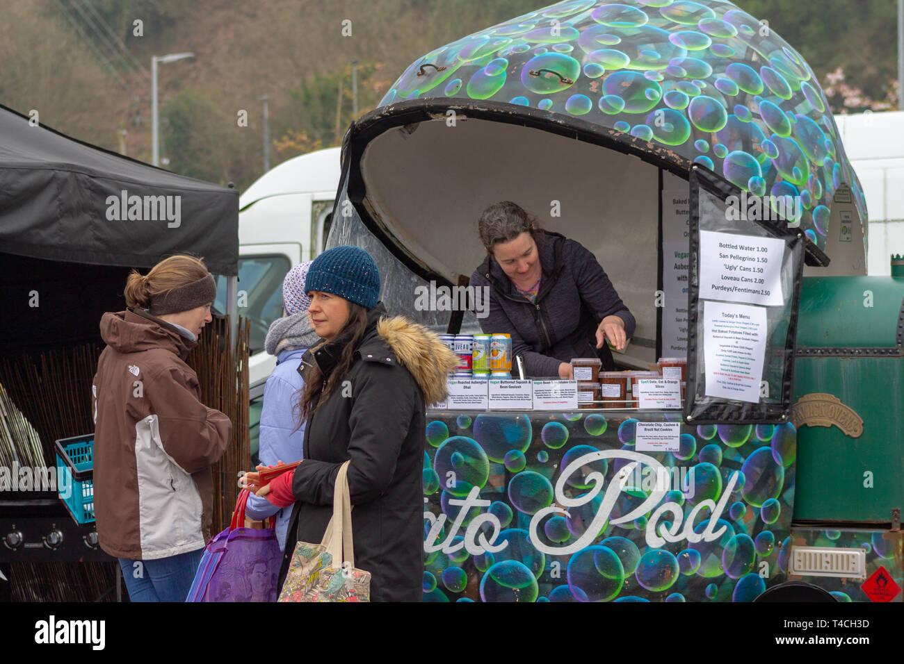 female selling food from a food pod selling food at an outdoor country ...