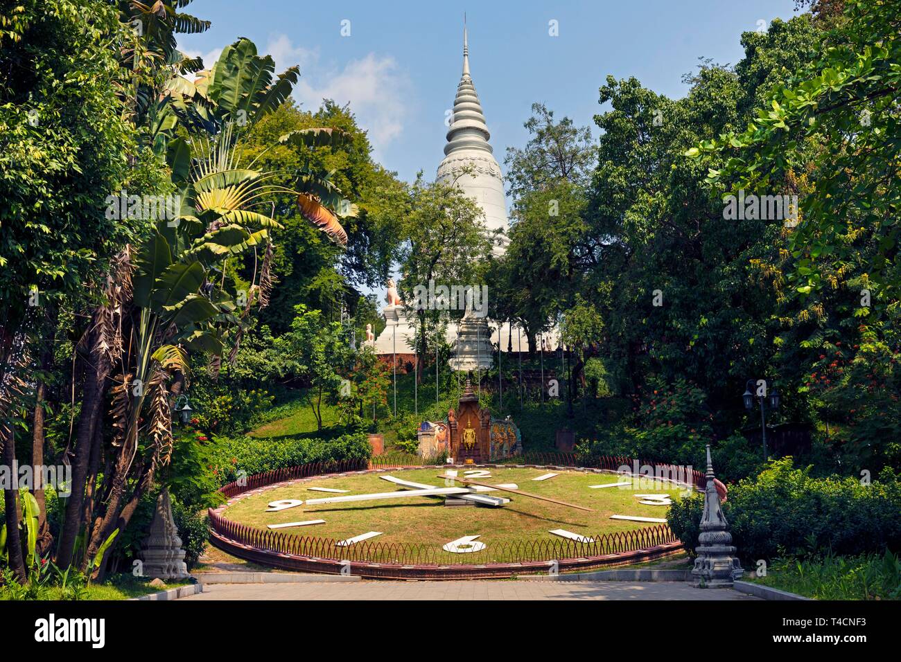 Clock in front of the large stupa in the temple complex Wat Phnom Daun ...