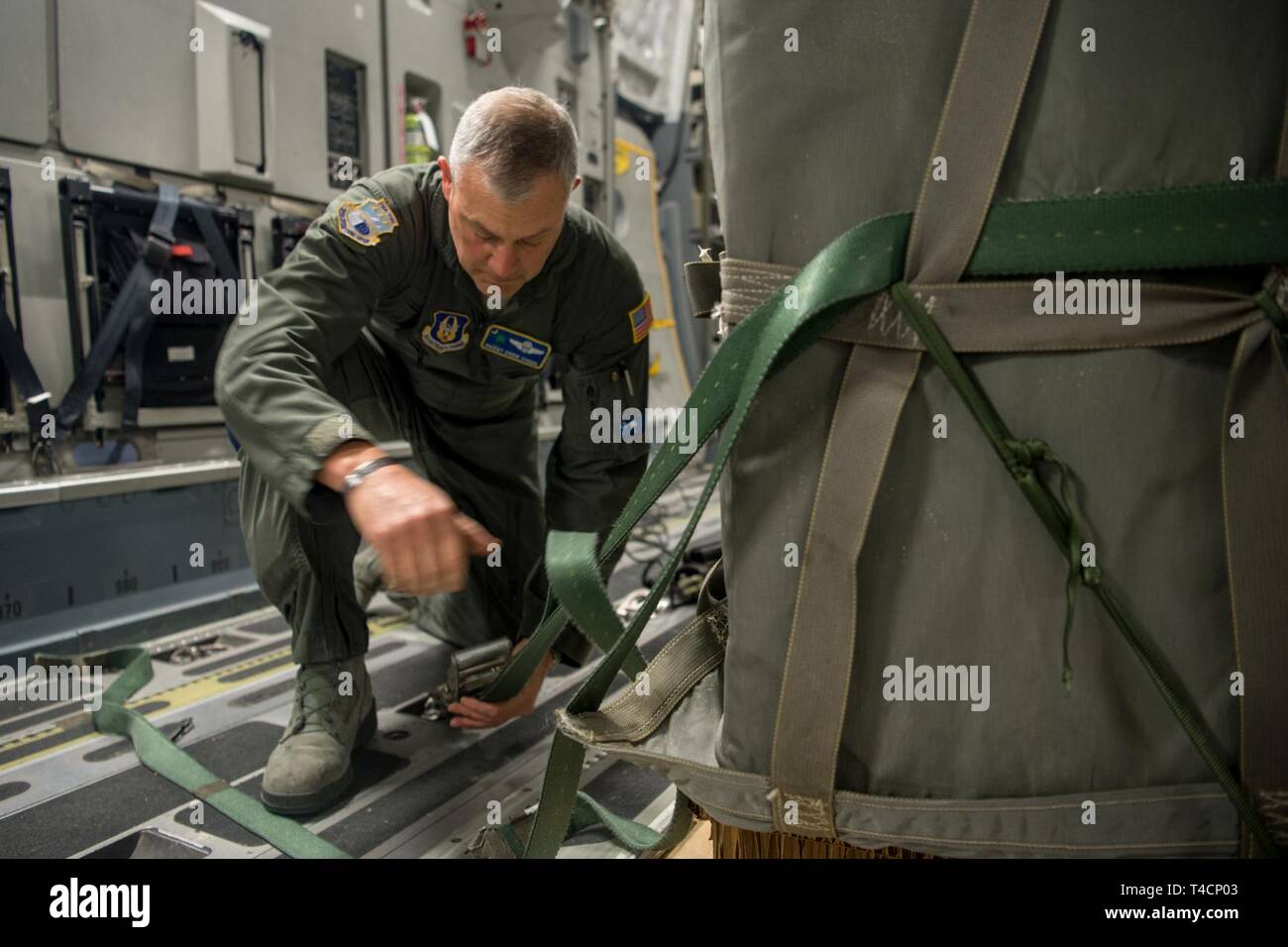 Senior Master Sgt. Andrew Cheek, a loadmaster with the 300th Airlift ...