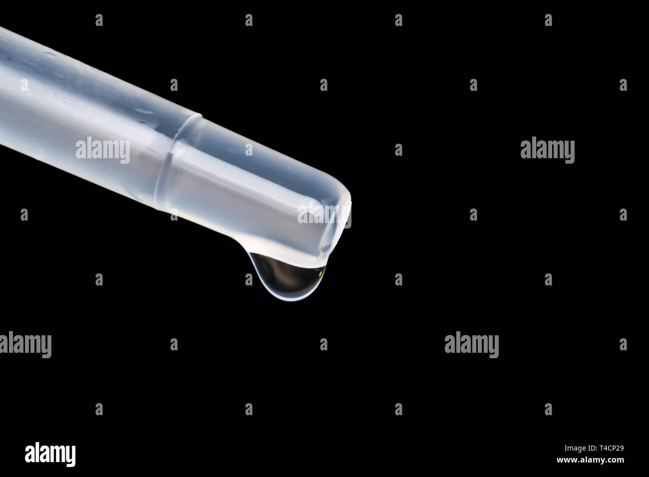 Plastic pipette with a drop of water at the top Stock Photo - Alamy