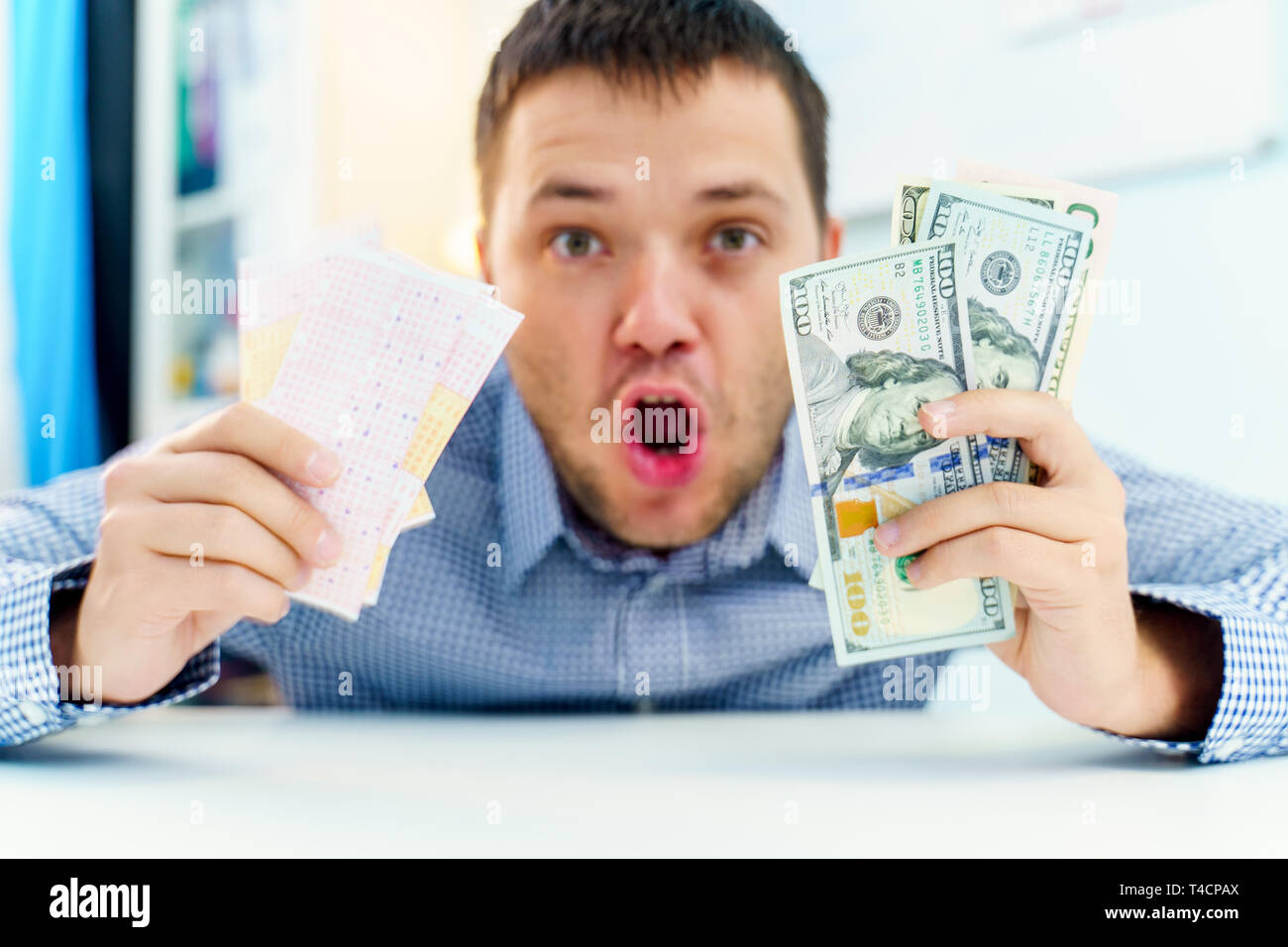 Man with lottery ticket hi-res stock photography and images - Alamy