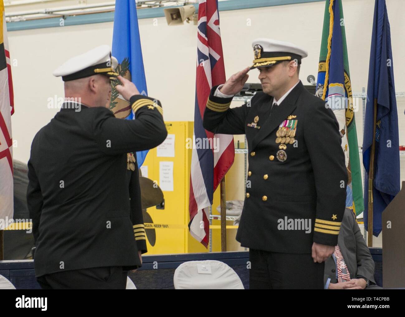 KEYPORT, Wash. (March 22, 2019) Cmdr. Scott Smith, from Hartford, South Dakota, left, turns over ...