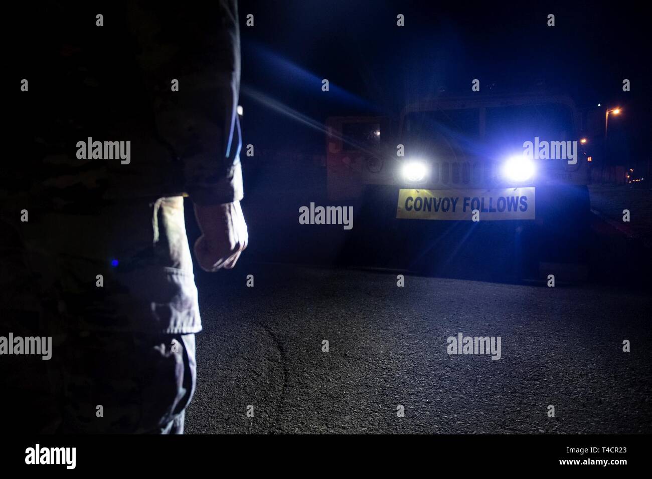 A Soldier ground guides the 15th Transportation Company, 100th Brigade ...