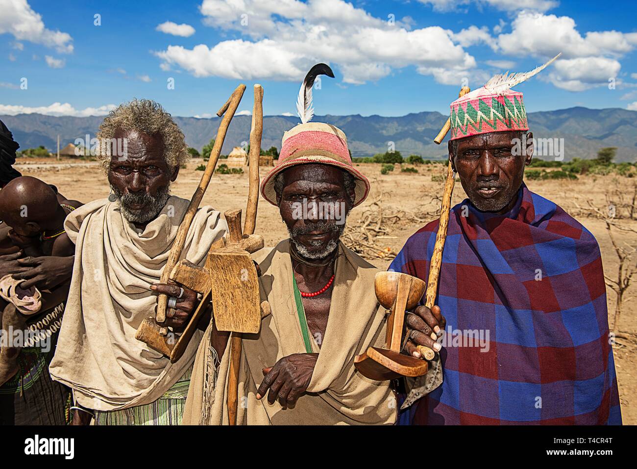 Men of the Erbore tribe with hats and sticks, Turmi, Lower Omo valley ...