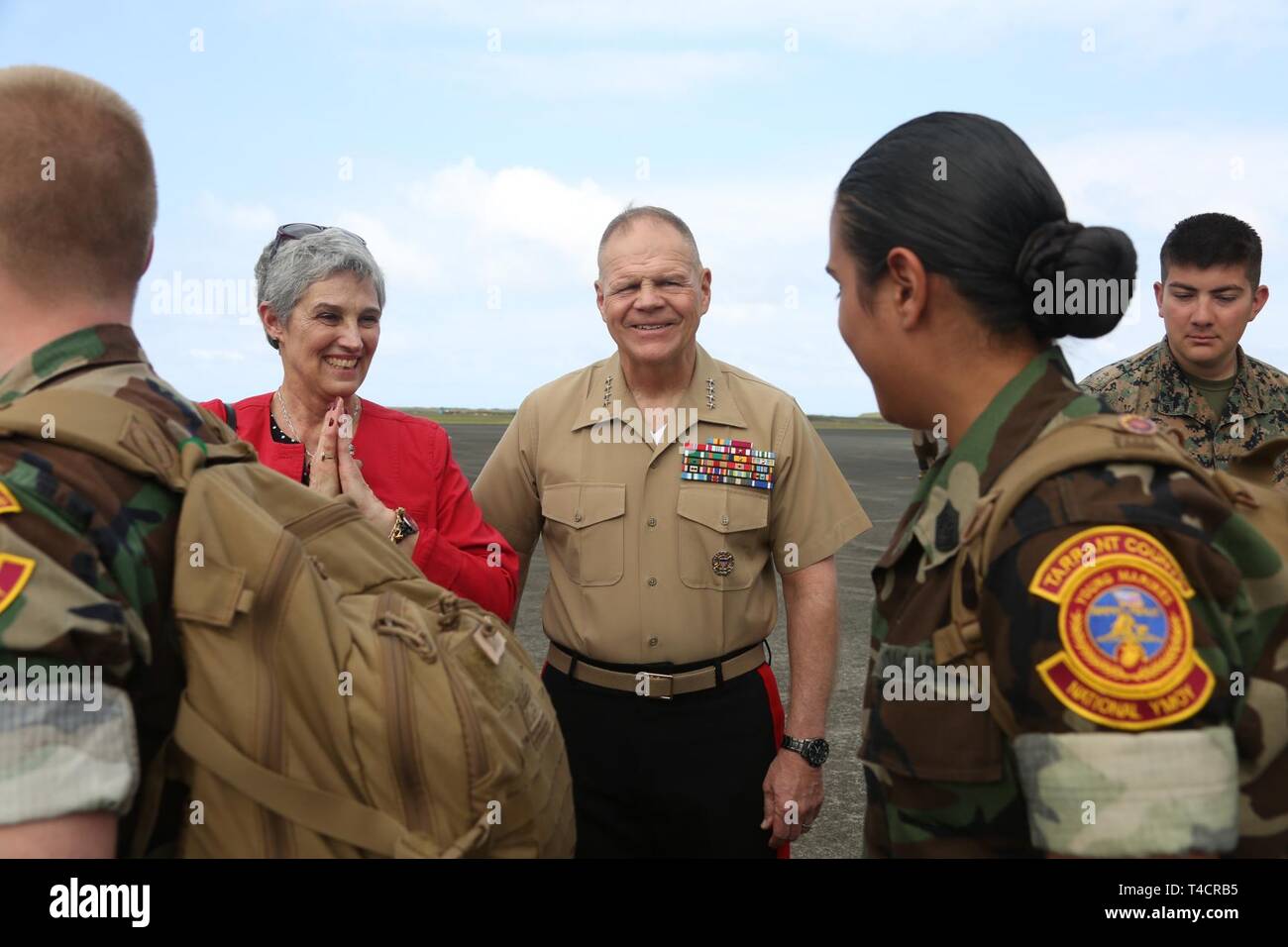 Commandant of the Marine Corps Gen. Robert B. Neller shakes hands with ...