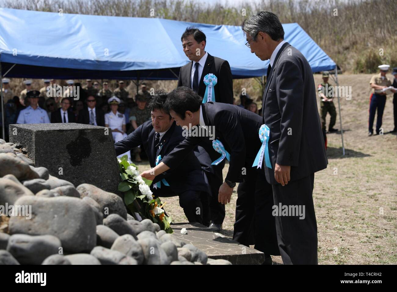 Japanese dignitaries lay a wreath at the Reunion of Honor Memorial ...
