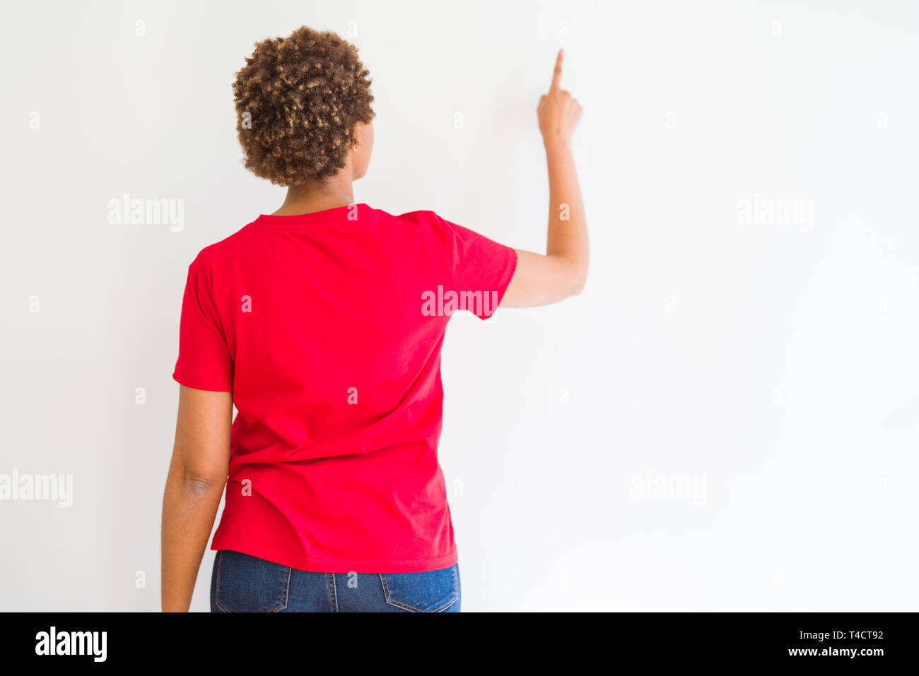 Young beautiful african american woman over white background Posing ...