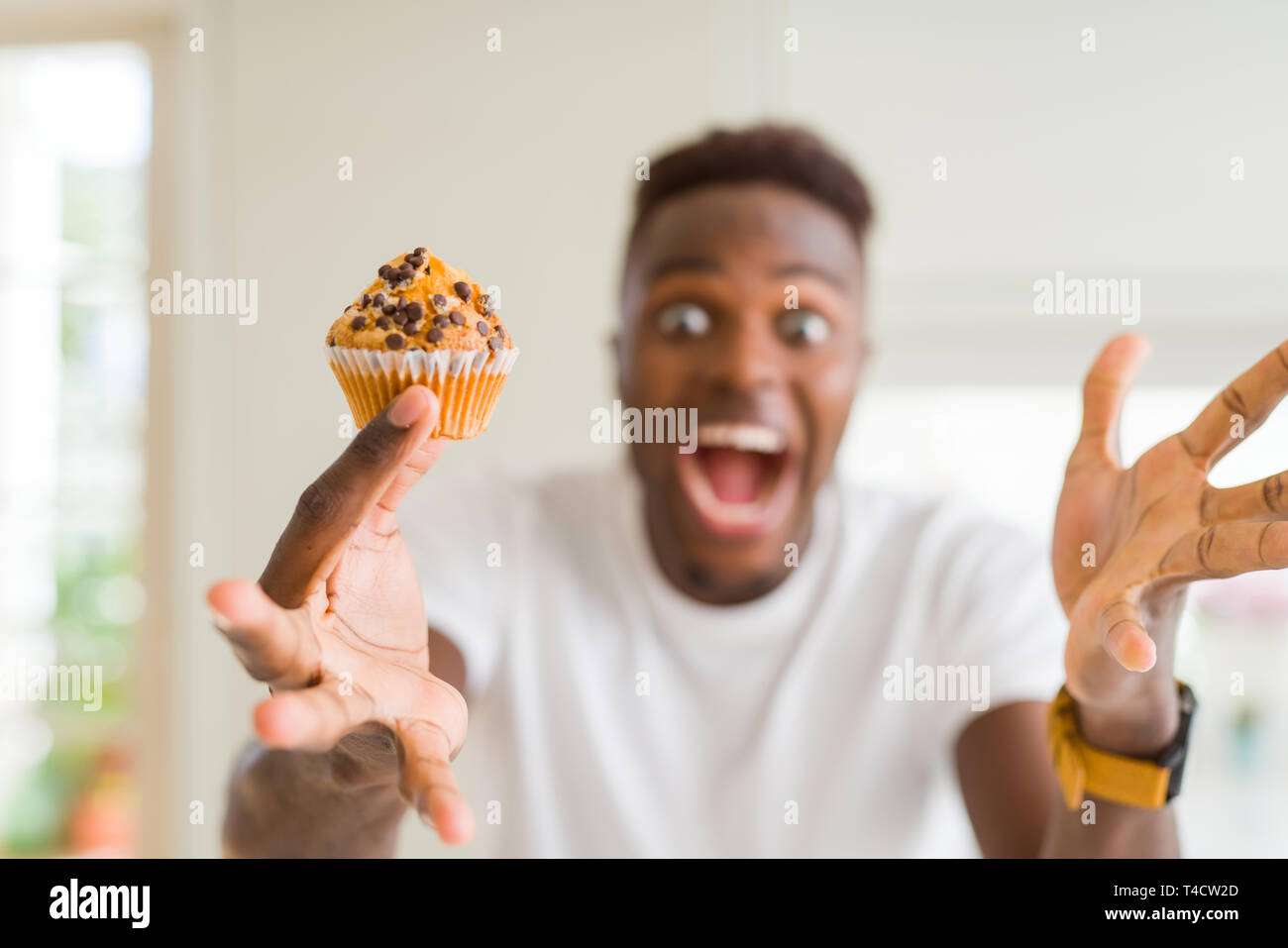 Man eating big muffin hi-res stock photography and images - Alamy
