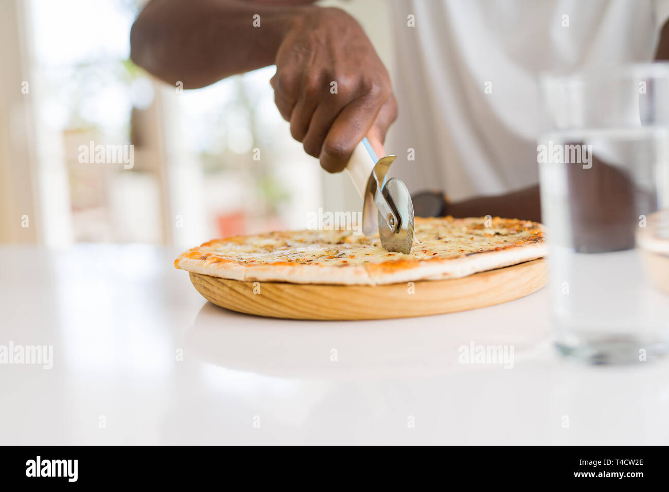 Cheerful delivery african man using hi-res stock photography and images ...