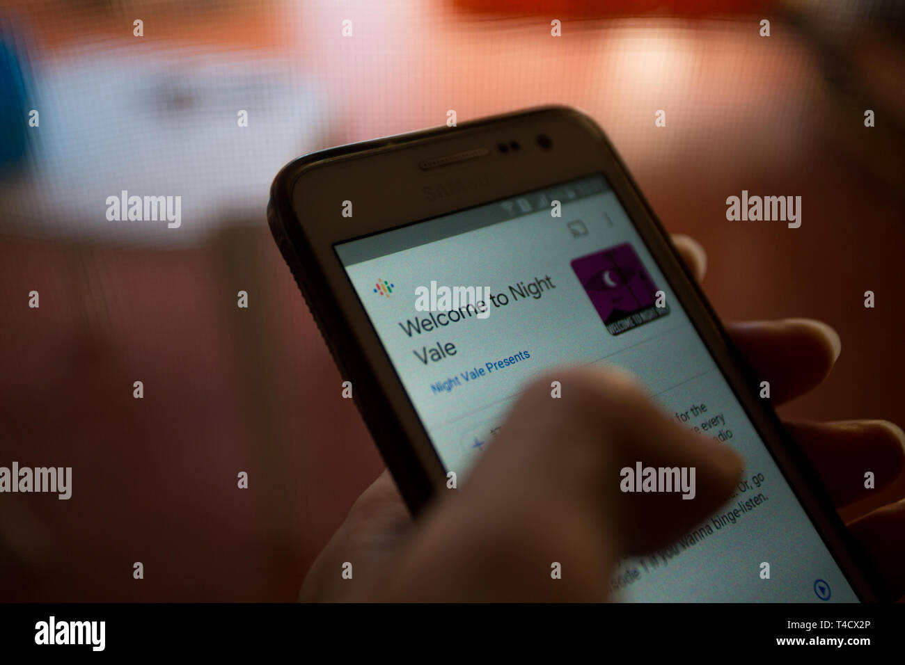 A smartphone with ‘Welcome to Night Vale’ podcast playing, indoors ...