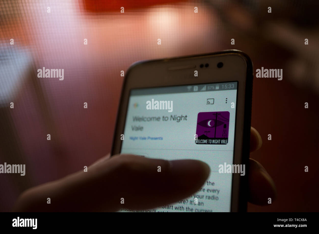 A smartphone with ‘Welcome to Night Vale’ podcast playing, indoors ...
