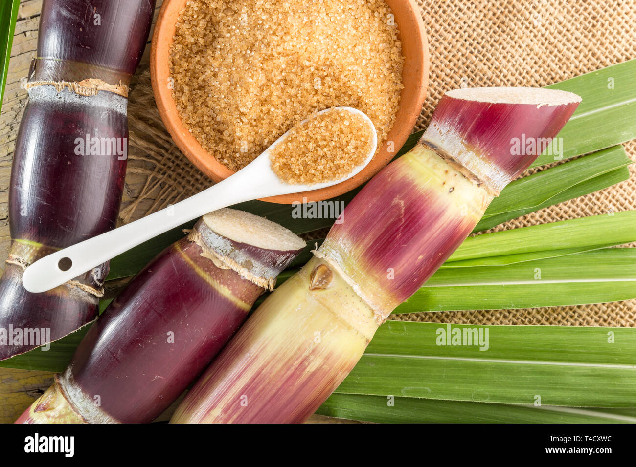 Brown sugar and cane on the table top view, image Stock Photo - Alamy