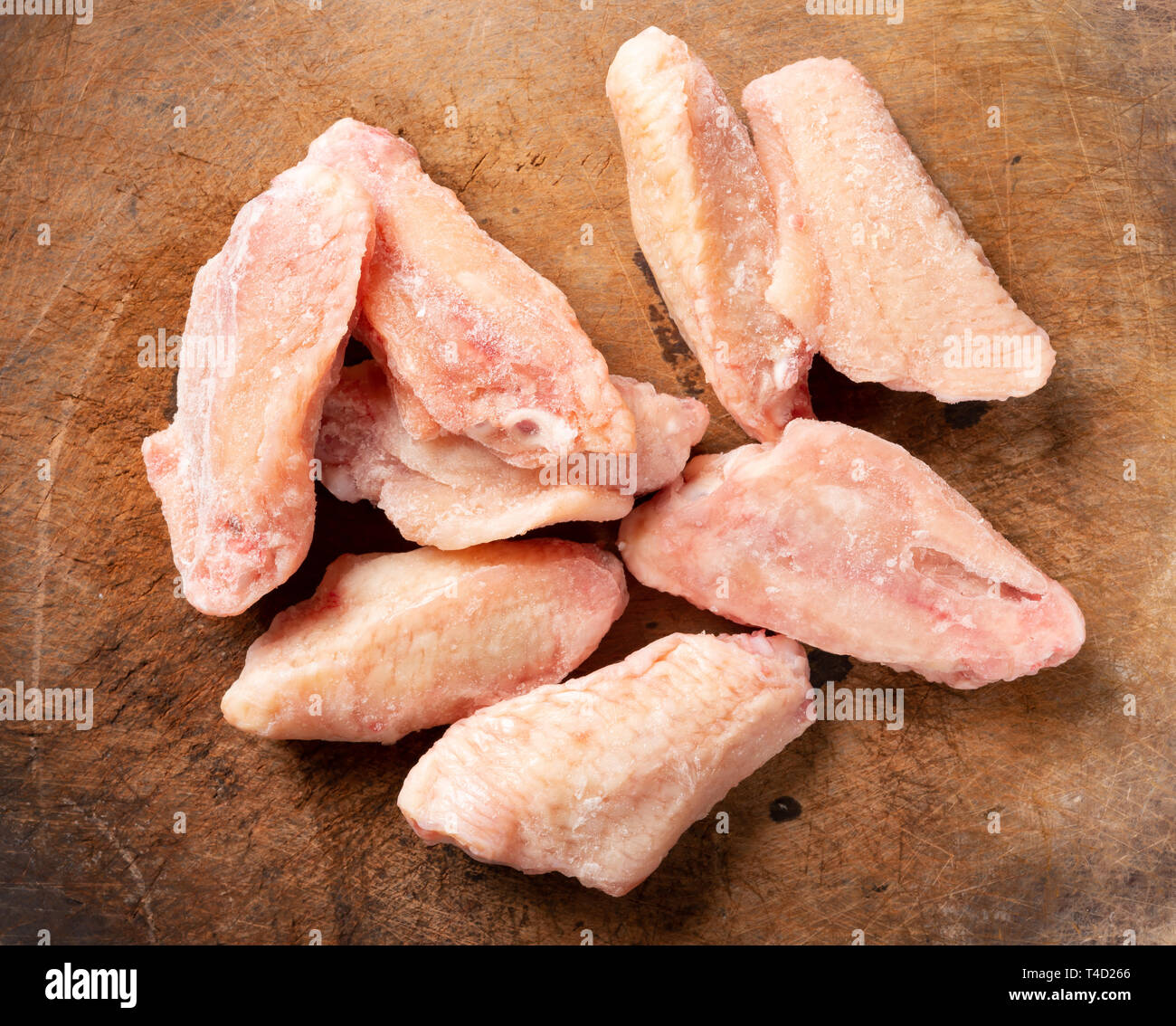 top view frozen raw chicken wings on chop board Stock Photo - Alamy