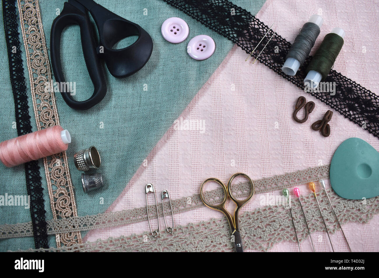 Sewing scene table flat lay composition. Threads, lace, pins, scissors ...