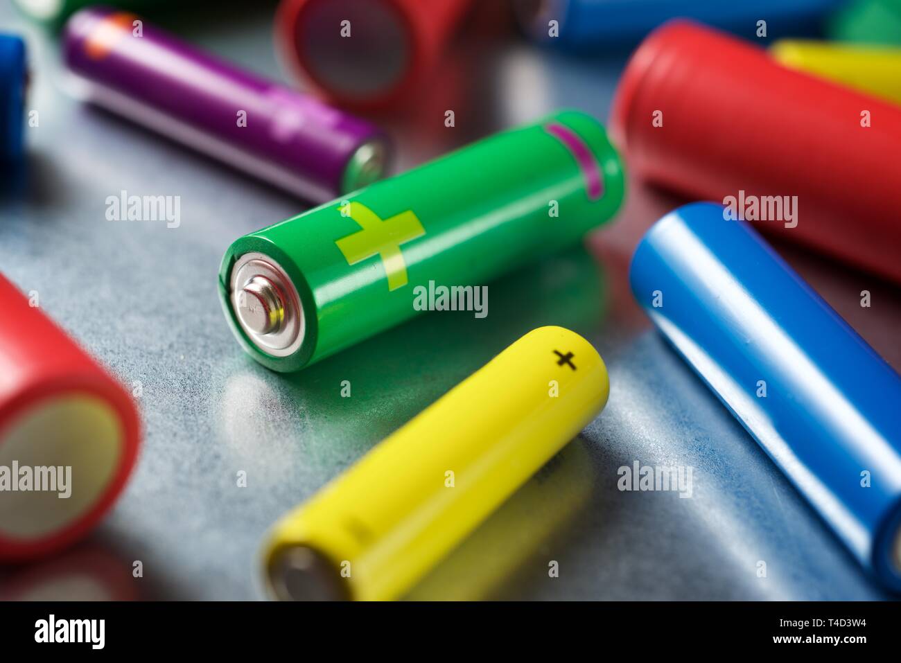 Many batteries on a metal table Stock Photo - Alamy