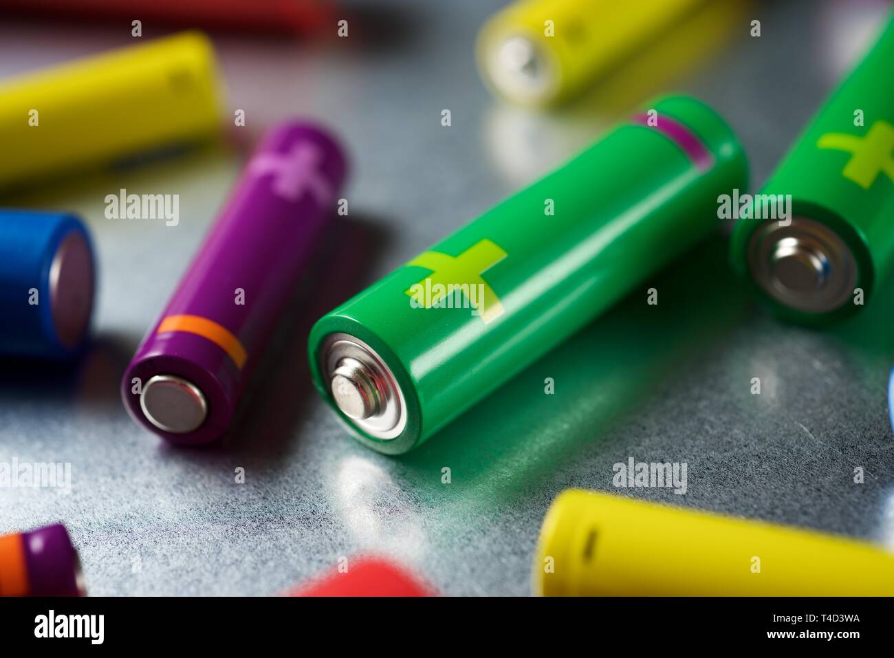 Many batteries on a metal table Stock Photo - Alamy