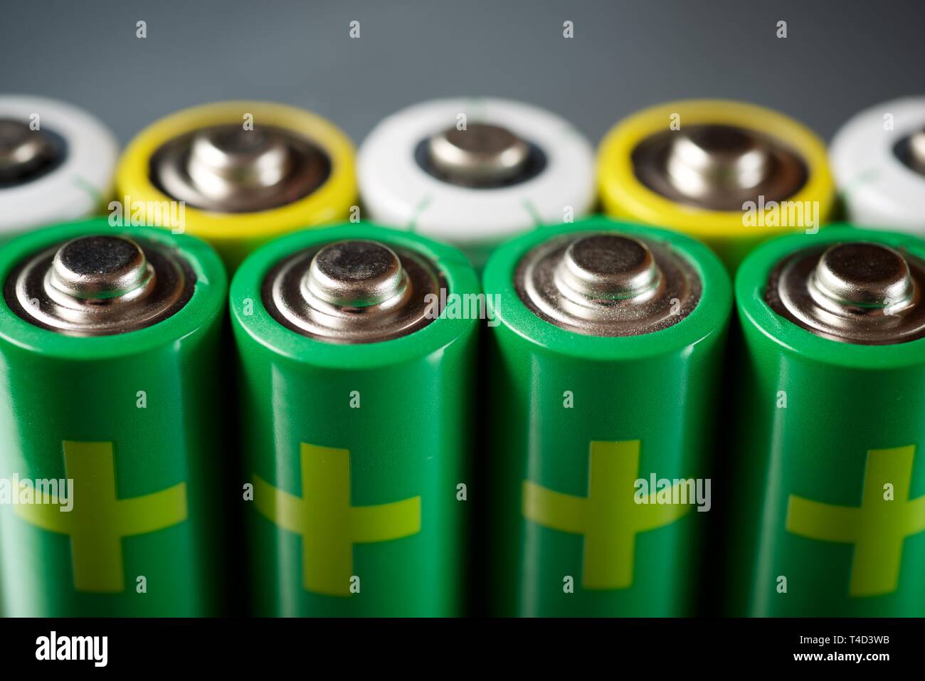 Many batteries on a metal table Stock Photo - Alamy