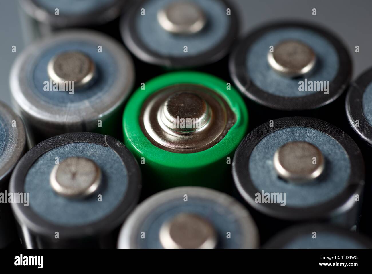 Many batteries on a metal table Stock Photo - Alamy