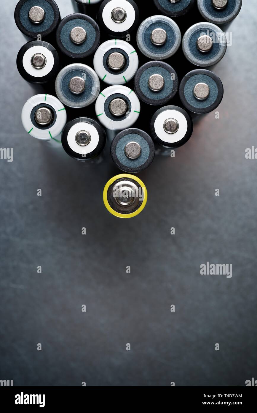 Many batteries on a metal table Stock Photo - Alamy