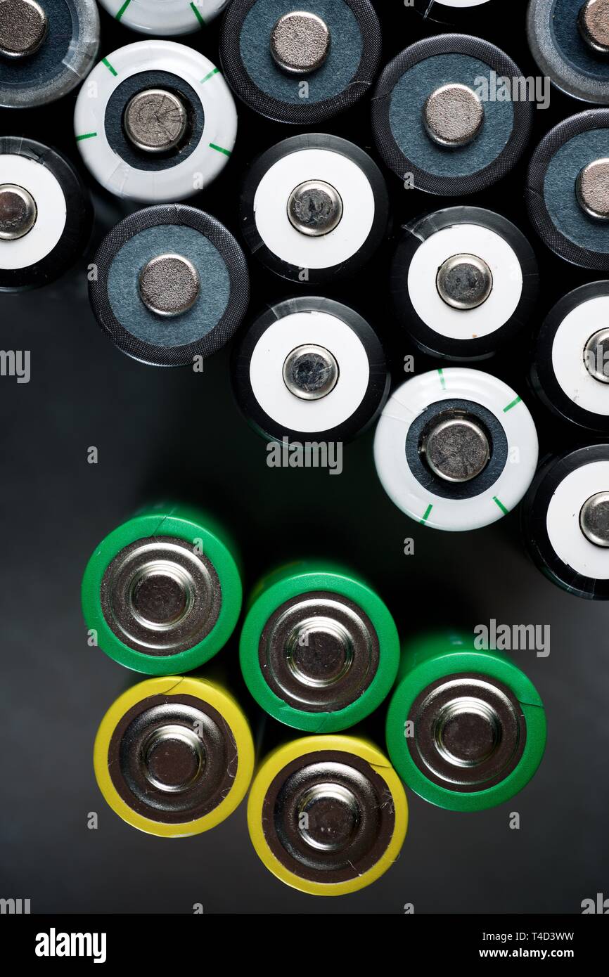 Many batteries on a metal table Stock Photo - Alamy